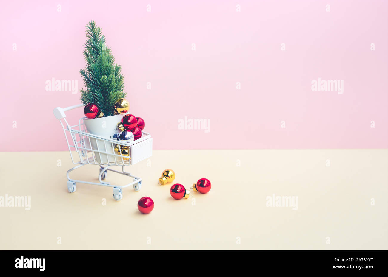 Red christmas ball and ornament on cart,trolley on pastel color ...