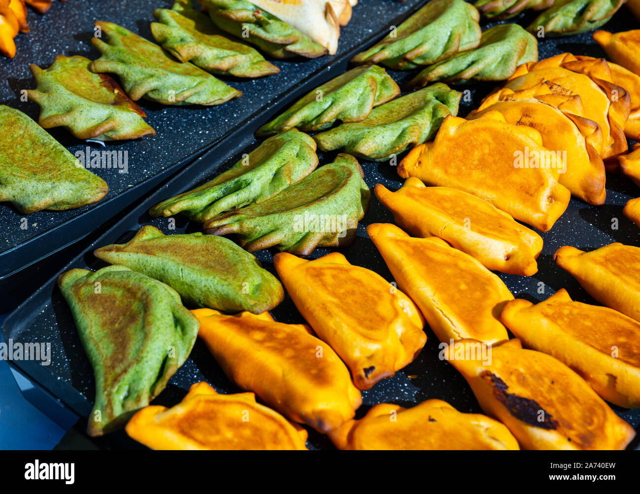 Colorful appetizing Empanadas on display in spanish street cafe Stock ...