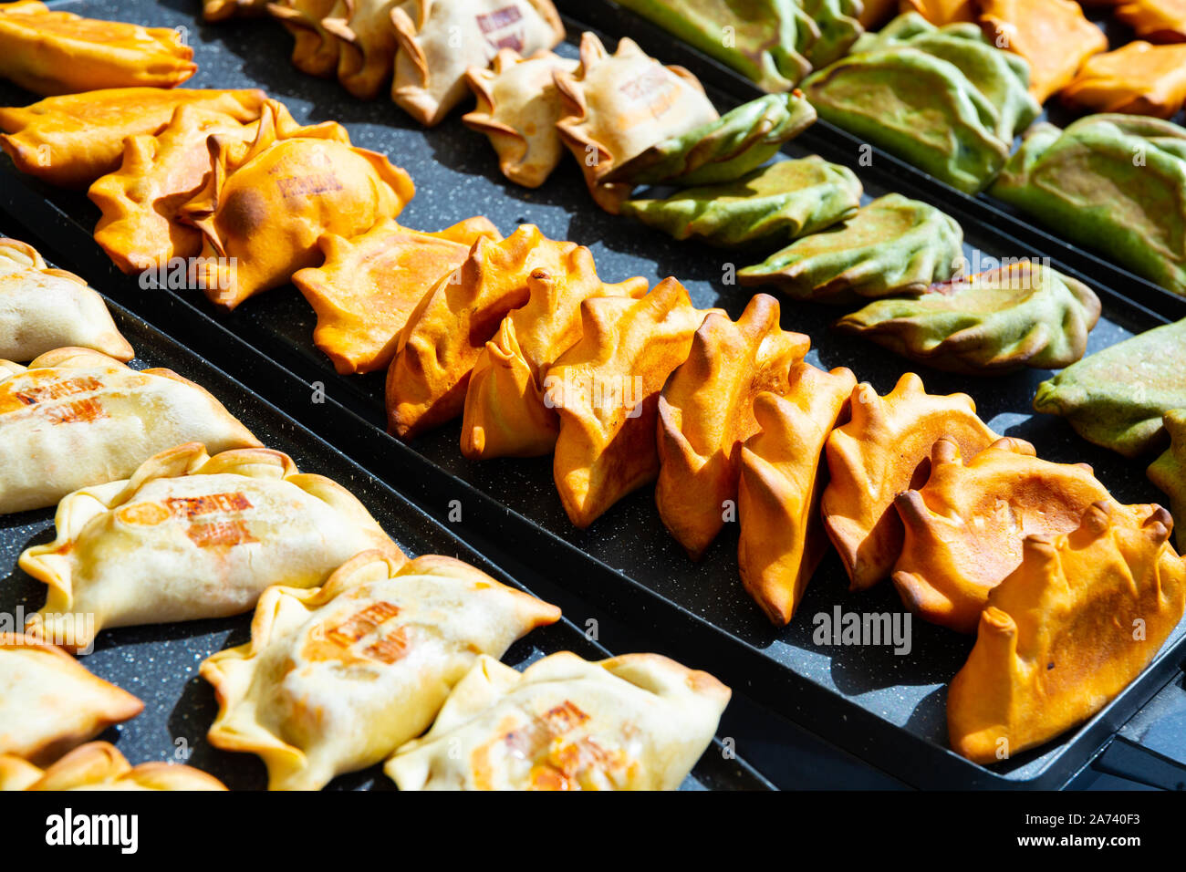 Colorful appetizing Empanadas on display in spanish street cafe Stock ...
