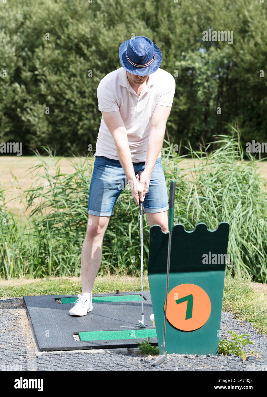 Golfer hit ball on golf course, summertime Stock Photo - Alamy