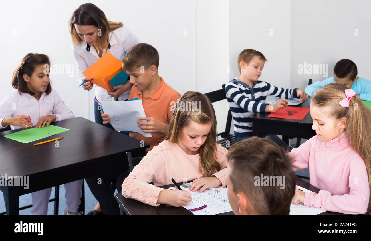 happy spanish children of elementary age having class of art Stock ...