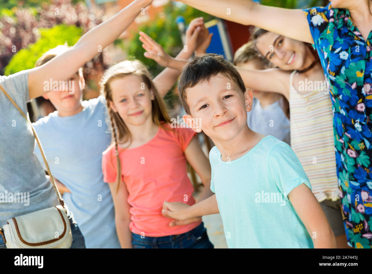 Two kids with children playing at a playground together Stock Photo - Alamy