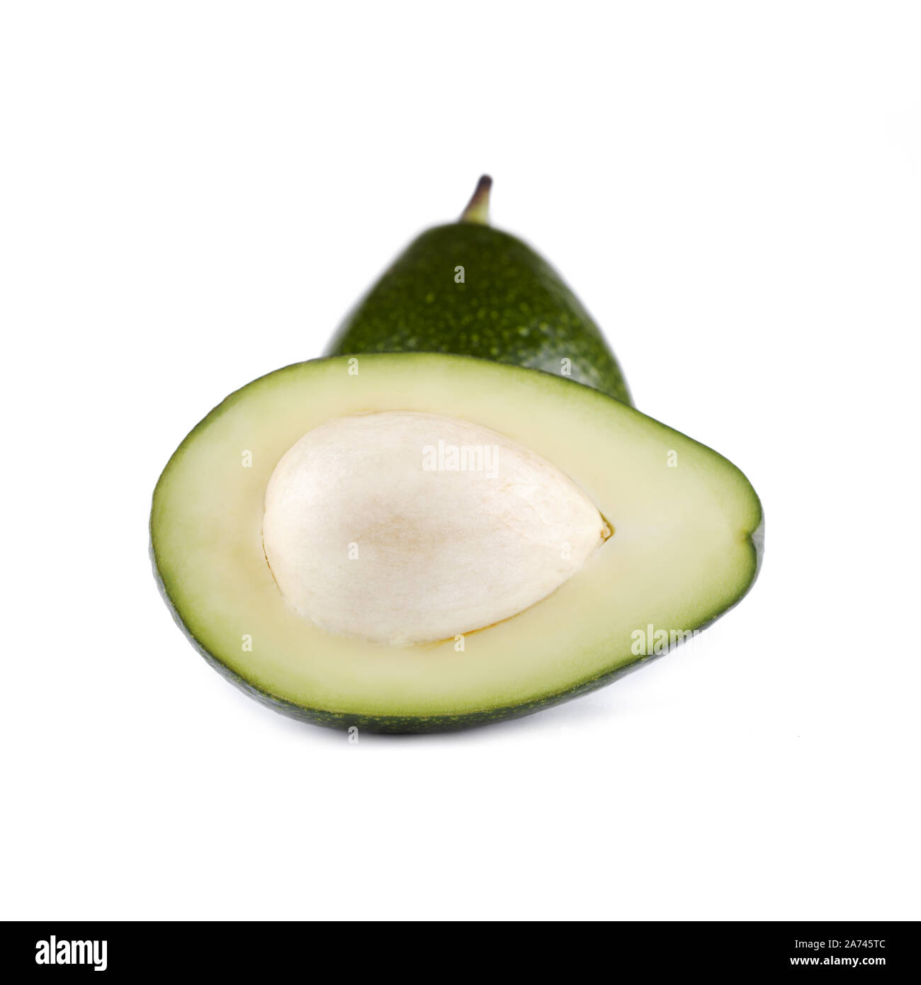 Cut green ripe avocado with seed isolated on white background Stock ...