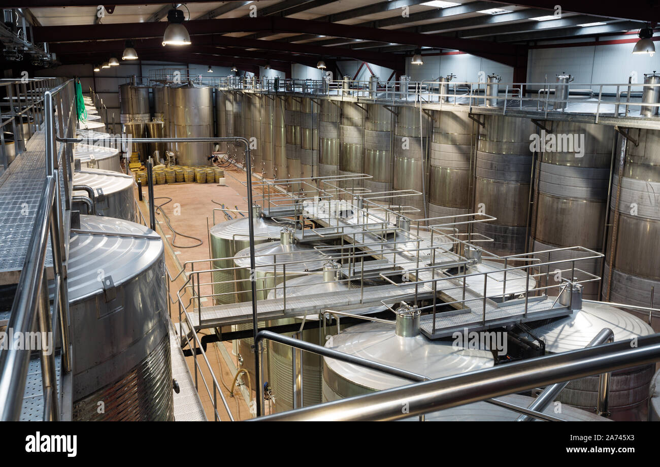 Interior of contemporary winery factory with barrels Stock Photo - Alamy