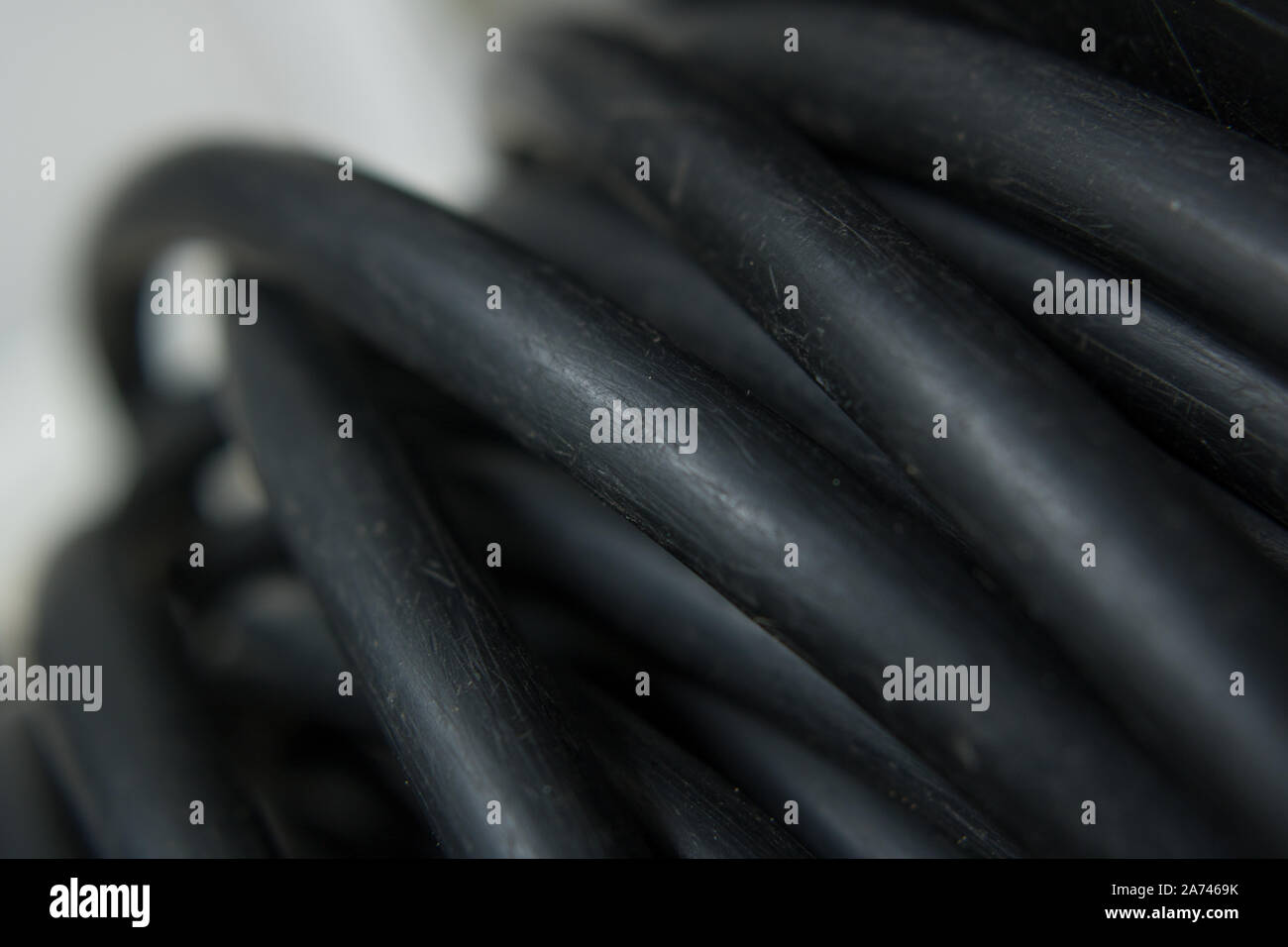 Abstract macro photography of black rubber cables Stock Photo - Alamy