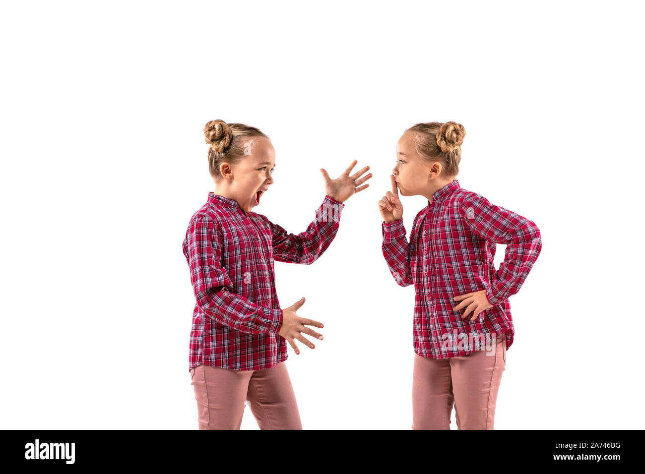 Young handsome girl arguing with herself on white studio background ...
