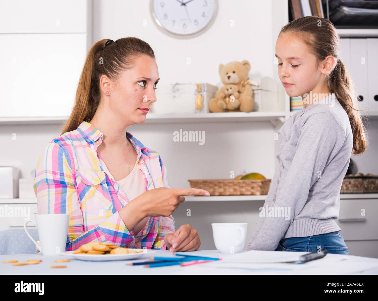 Young mother scolding her daughter for bad behavior and mistakes Stock Photo - Alamy