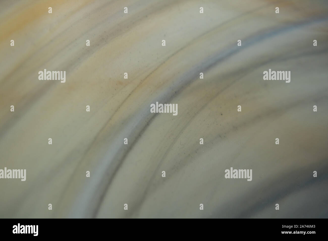 Abstract photography of curves resembling planet surfaces or rings ...