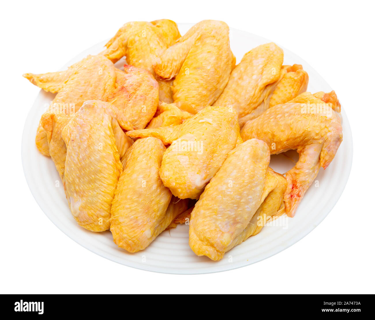 Fresh uncooked wings of yellow chicken. Isolated over white background ...