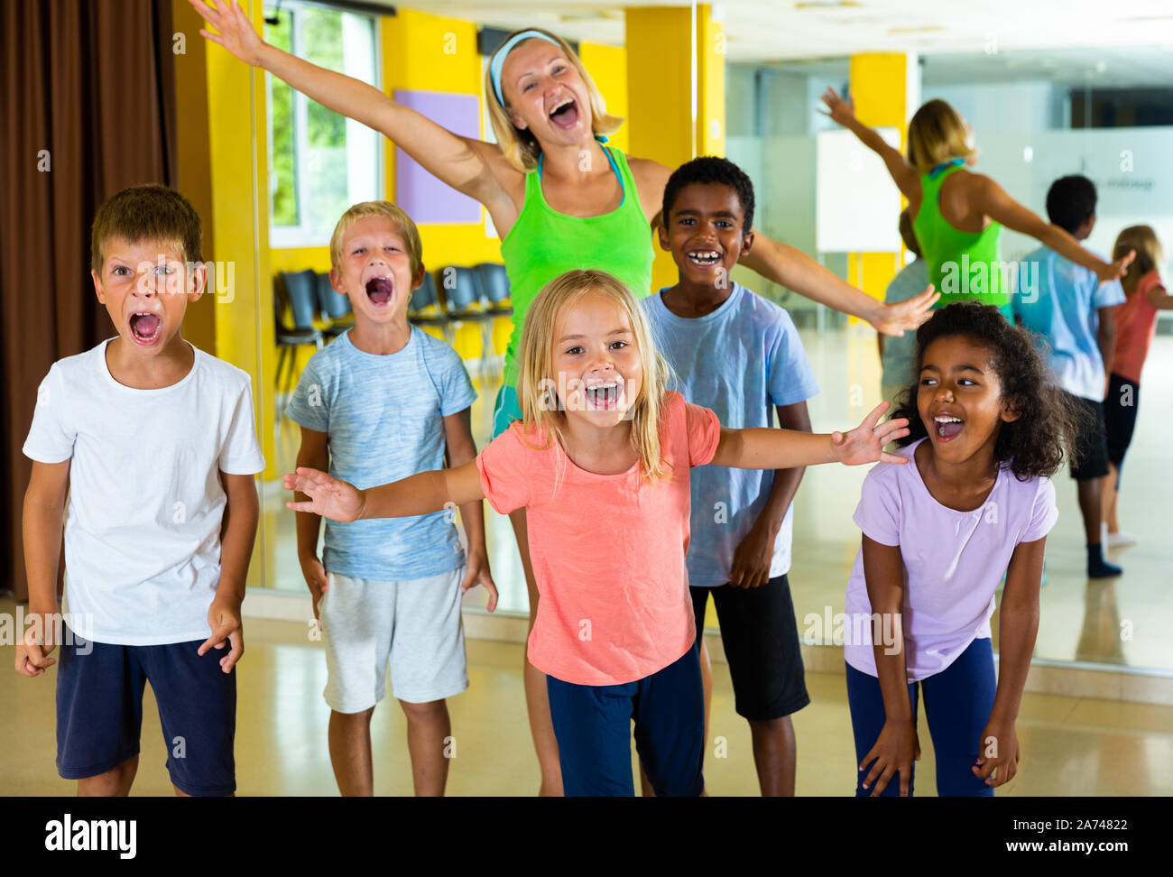 Positive children in dance studio smiling and having fun Stock Photo ...