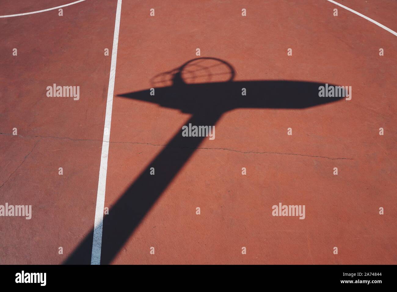 basketball hoop shadow silhouette on the court on the street Stock ...