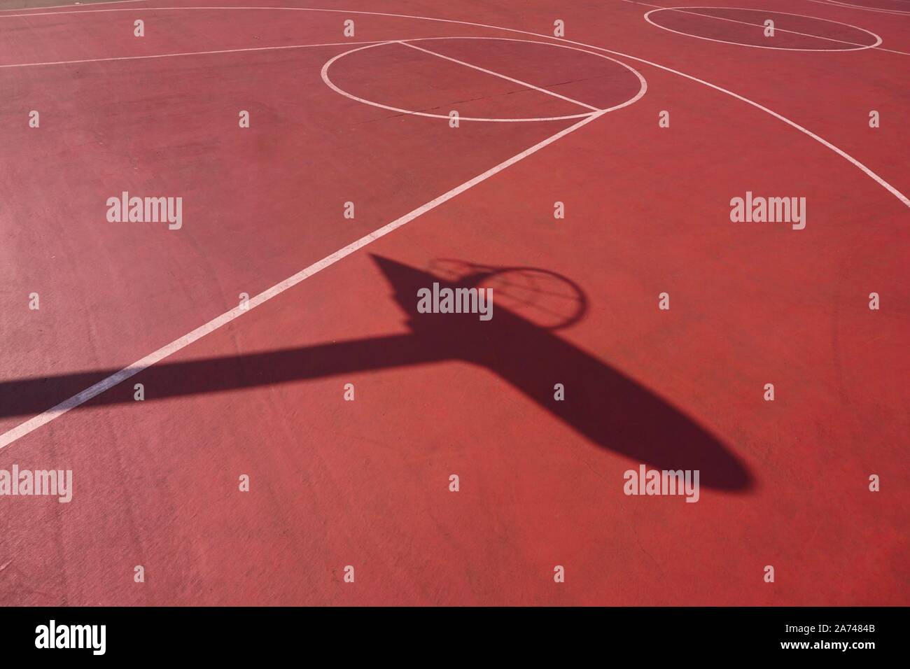 basketball hoop shadow silhouette on the court on the street Stock ...