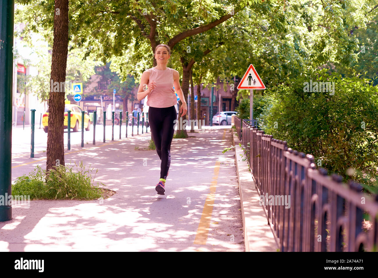 Full woman sport running in the city hi-res stock photography and ...