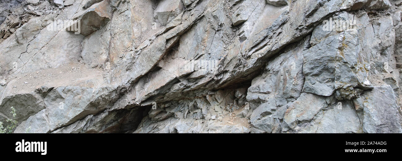 Close-up of abstract rock texture background with cracks and chips ...
