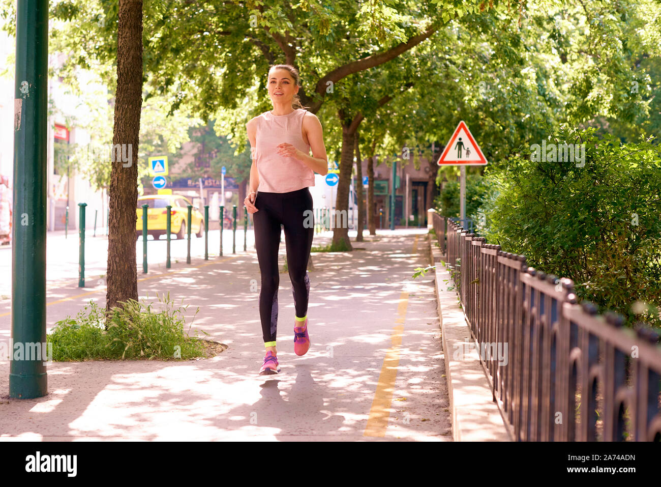 Full woman sport running in the city hi-res stock photography and ...