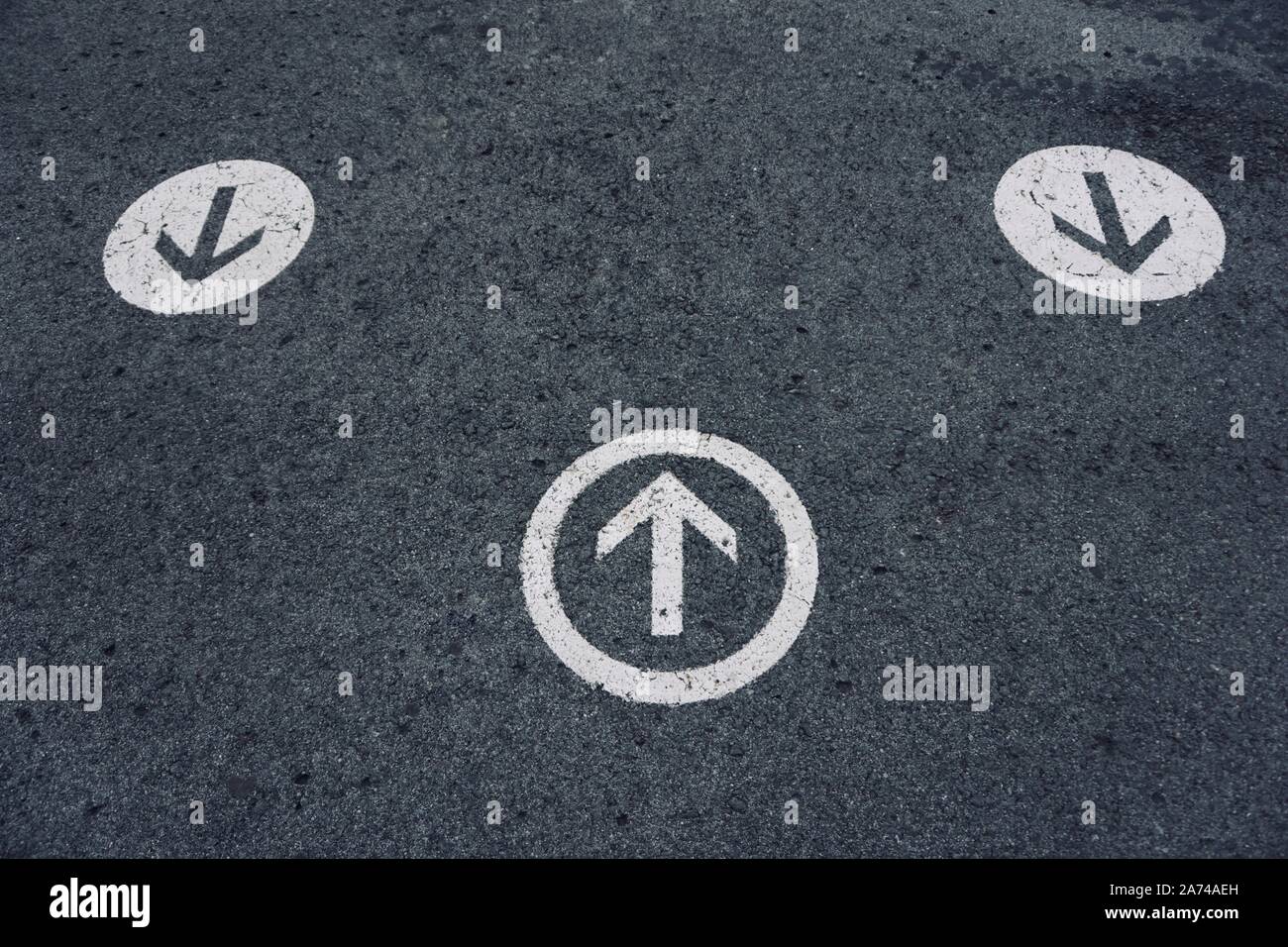 arrow road sign on the road on the street Stock Photo - Alamy