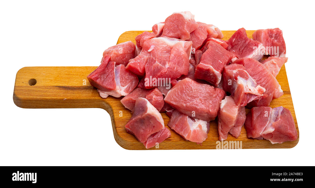 Fresh uncooked chopped pork for stew. Isolated over white background ...