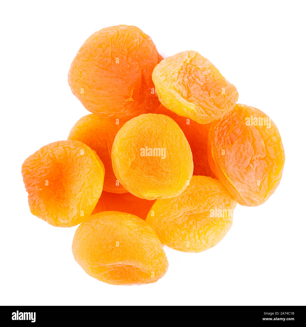 Dried apricot ingredient closeup isolated on a white background. One ...