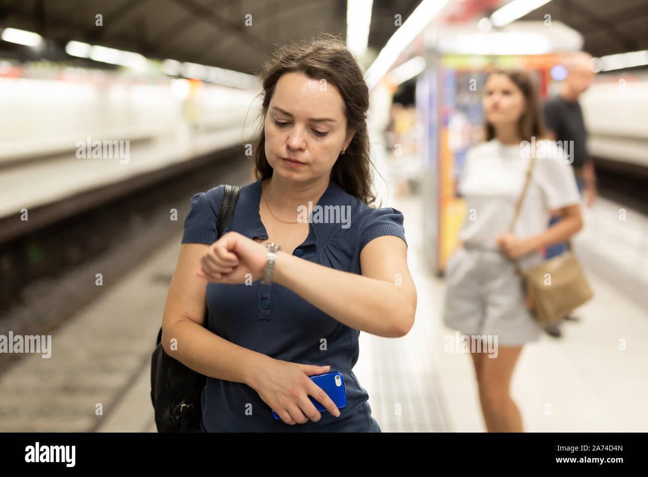 Hurrying woman is late for subway train Stock Photo - Alamy