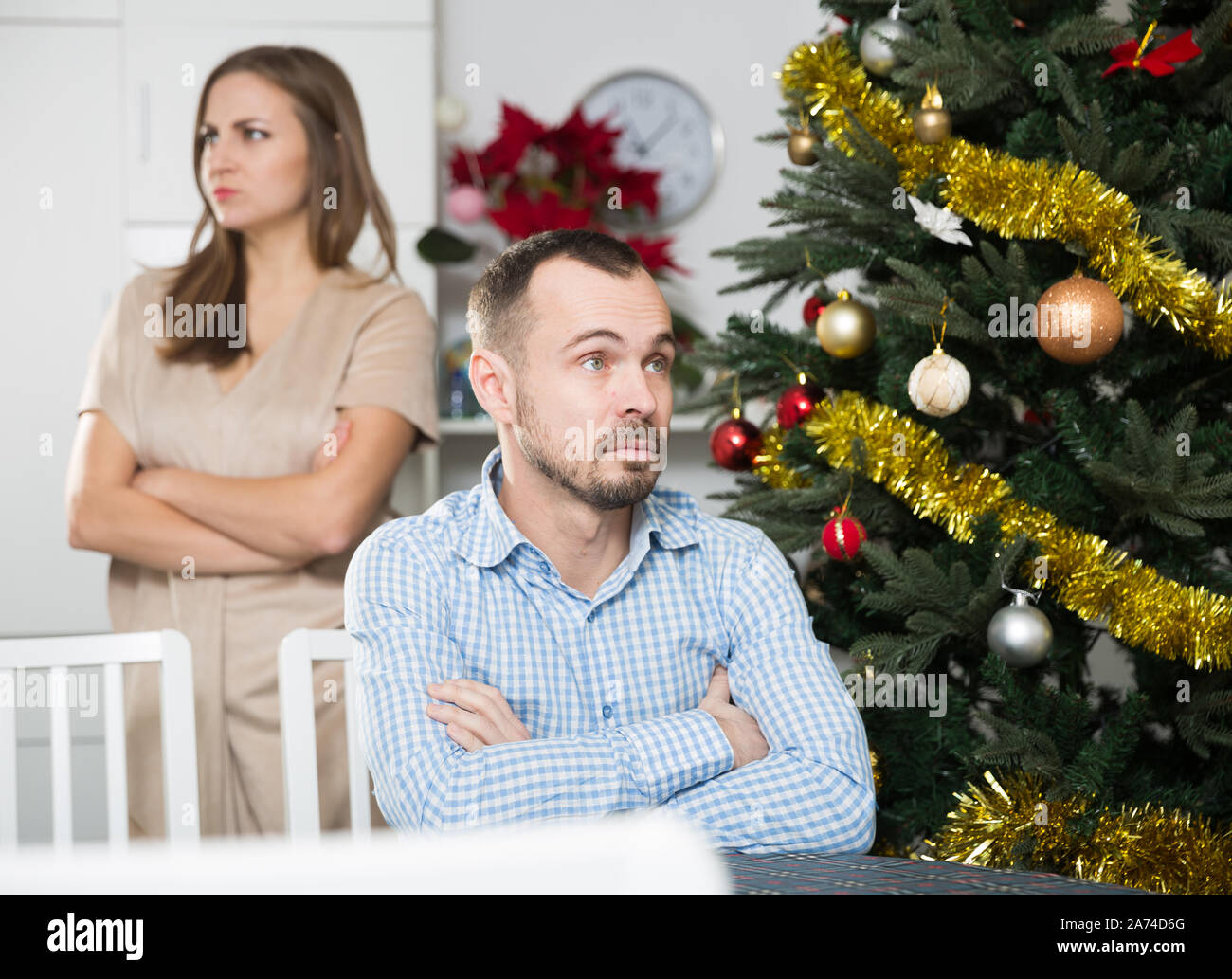 Angry man and woman quarreling during Christmas night Stock Photo - Alamy
