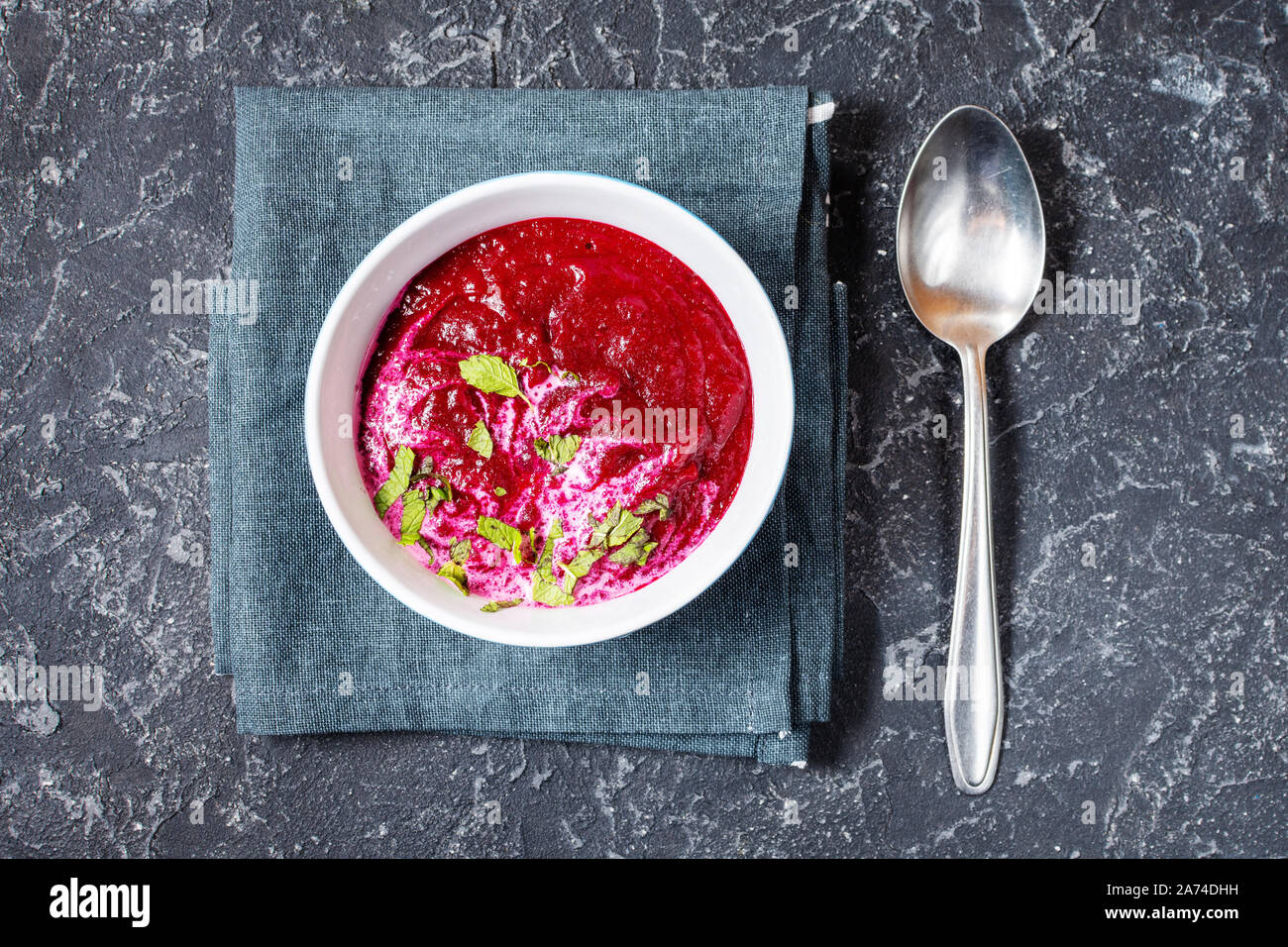 Soup of pureed red beets on black stone background. Top view Stock ...