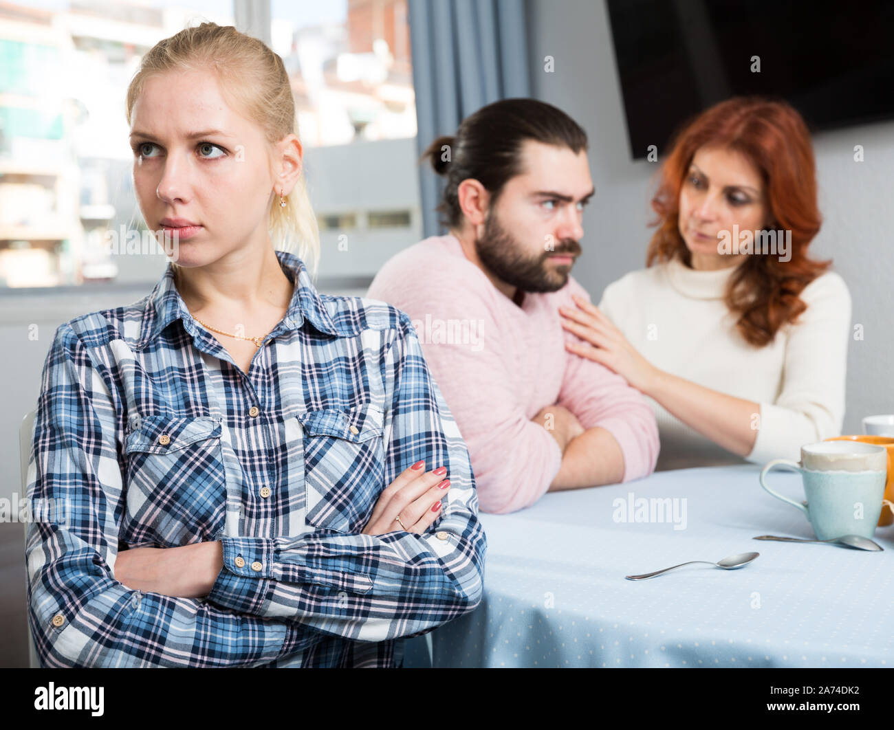 Young married couple and senior mother having bad discussion Stock ...