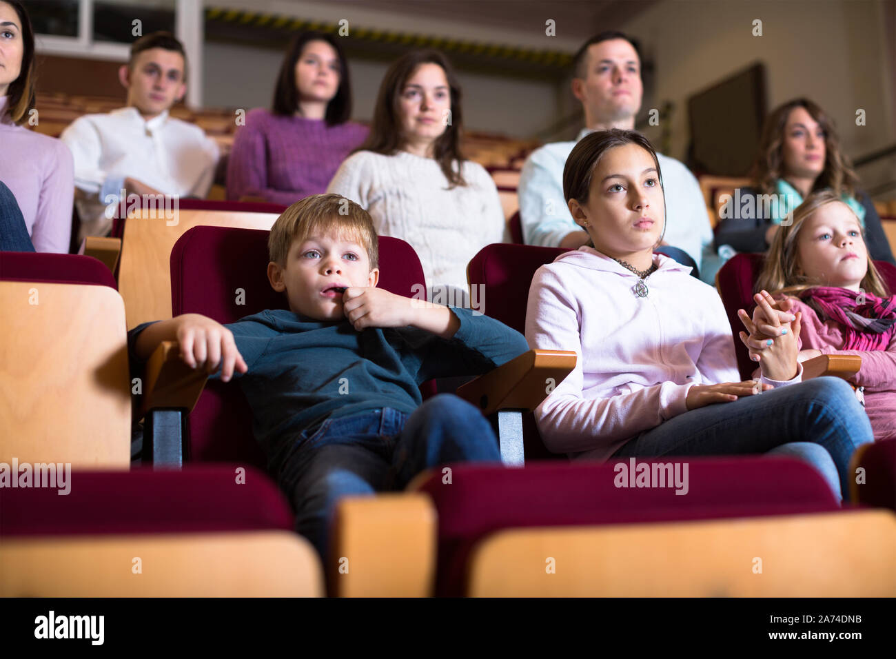 People audience attending movie night in cinema house Stock Photo - Alamy