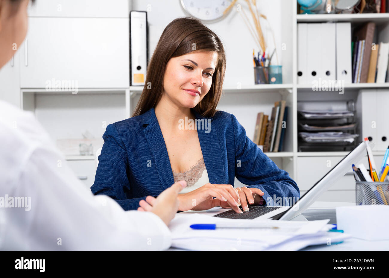 Successful businesswoman communicates with the client in the office ...