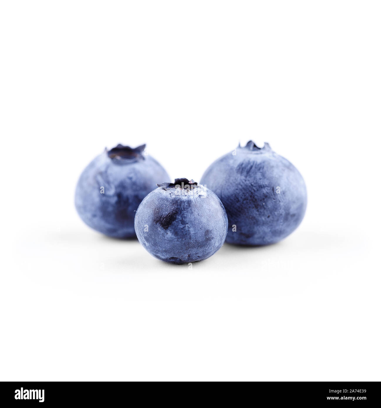 Three raw blueberries isolated on white with clipping path Stock Photo ...