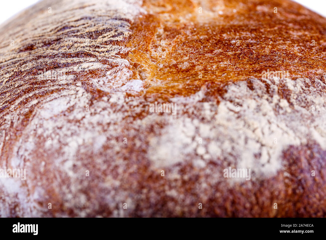 Brown bread top view texture floured. Loaf photo Stock Photo - Alamy