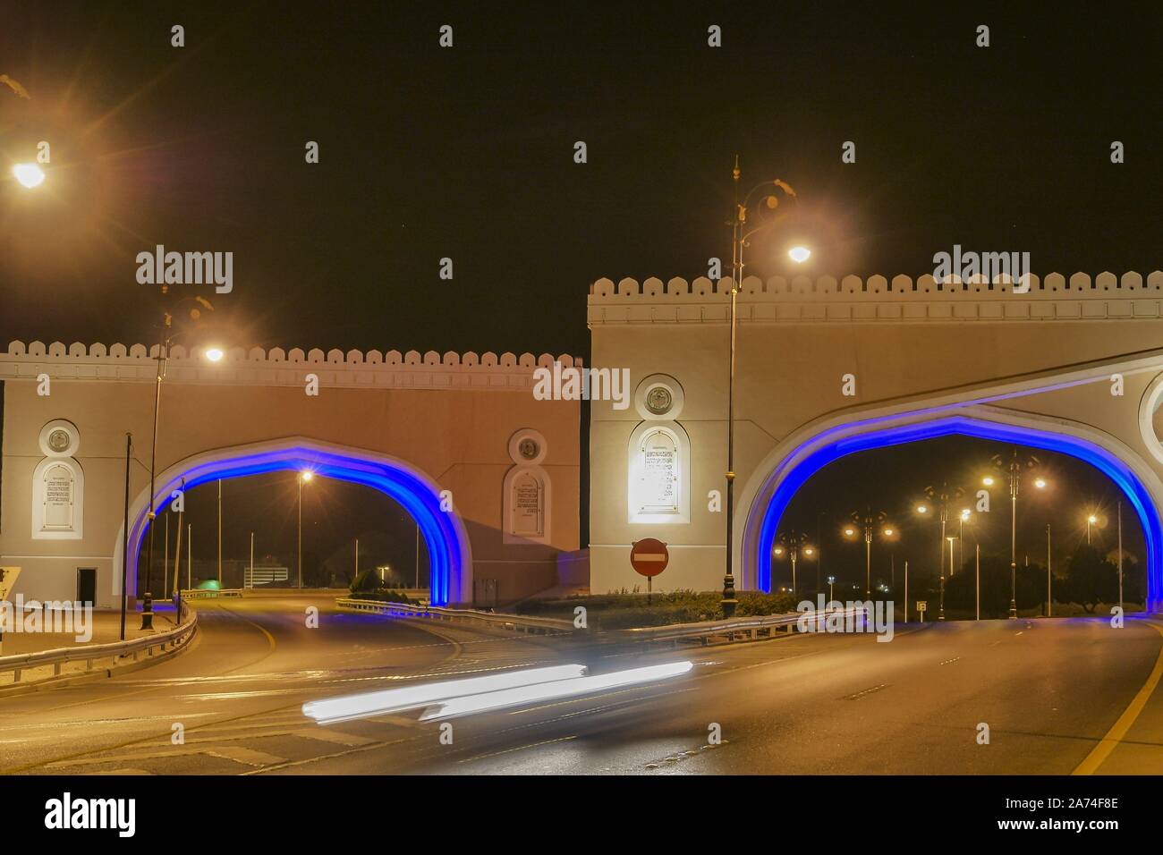Muscat, Oman Illuminated entrance gateway by road to the Muttrah and ...