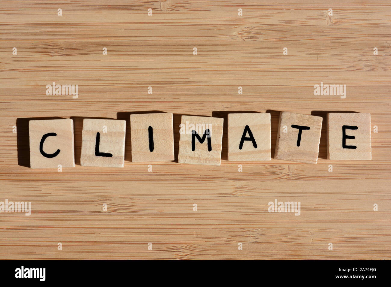 Climate, in 3d wooden alphabet letters on a wooden background Stock ...