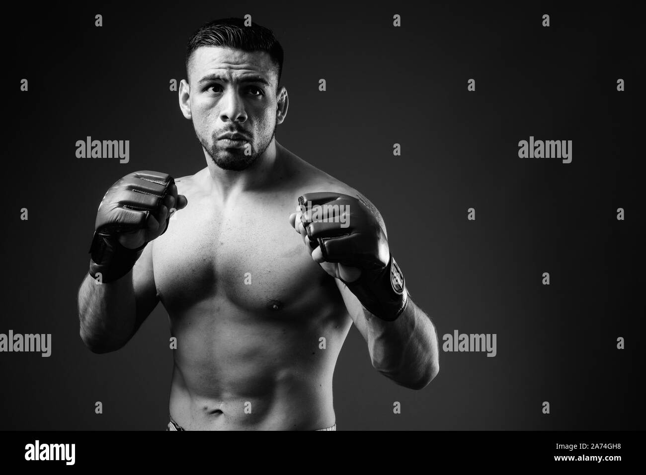 Portrait of young muscular Hispanic man as boxer shirtless Stock Photo ...