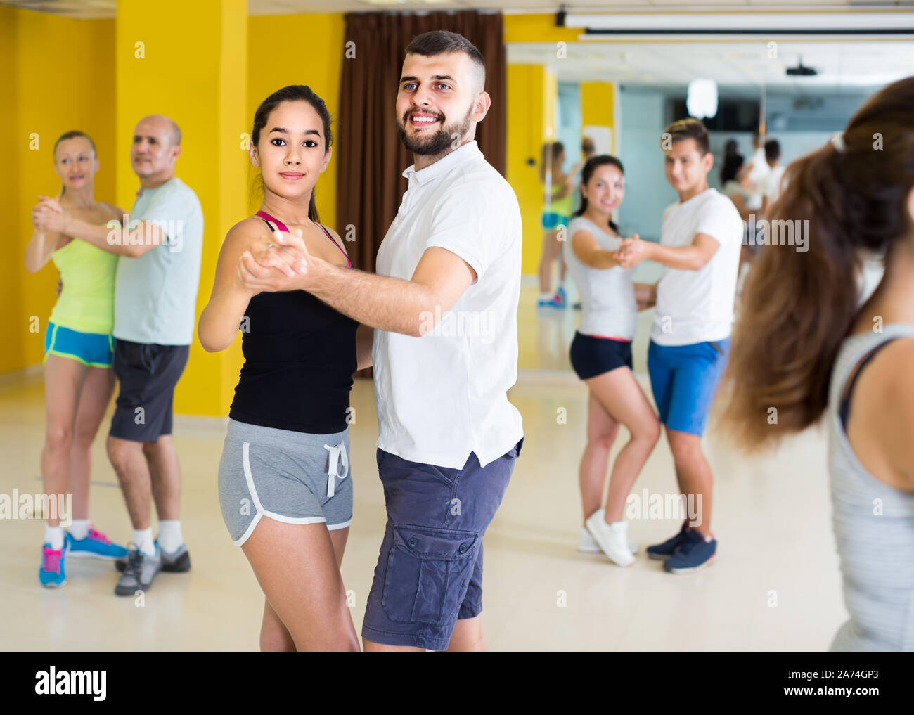 Young sporty belorusian girls and men learning salsa steps Stock Photo ...