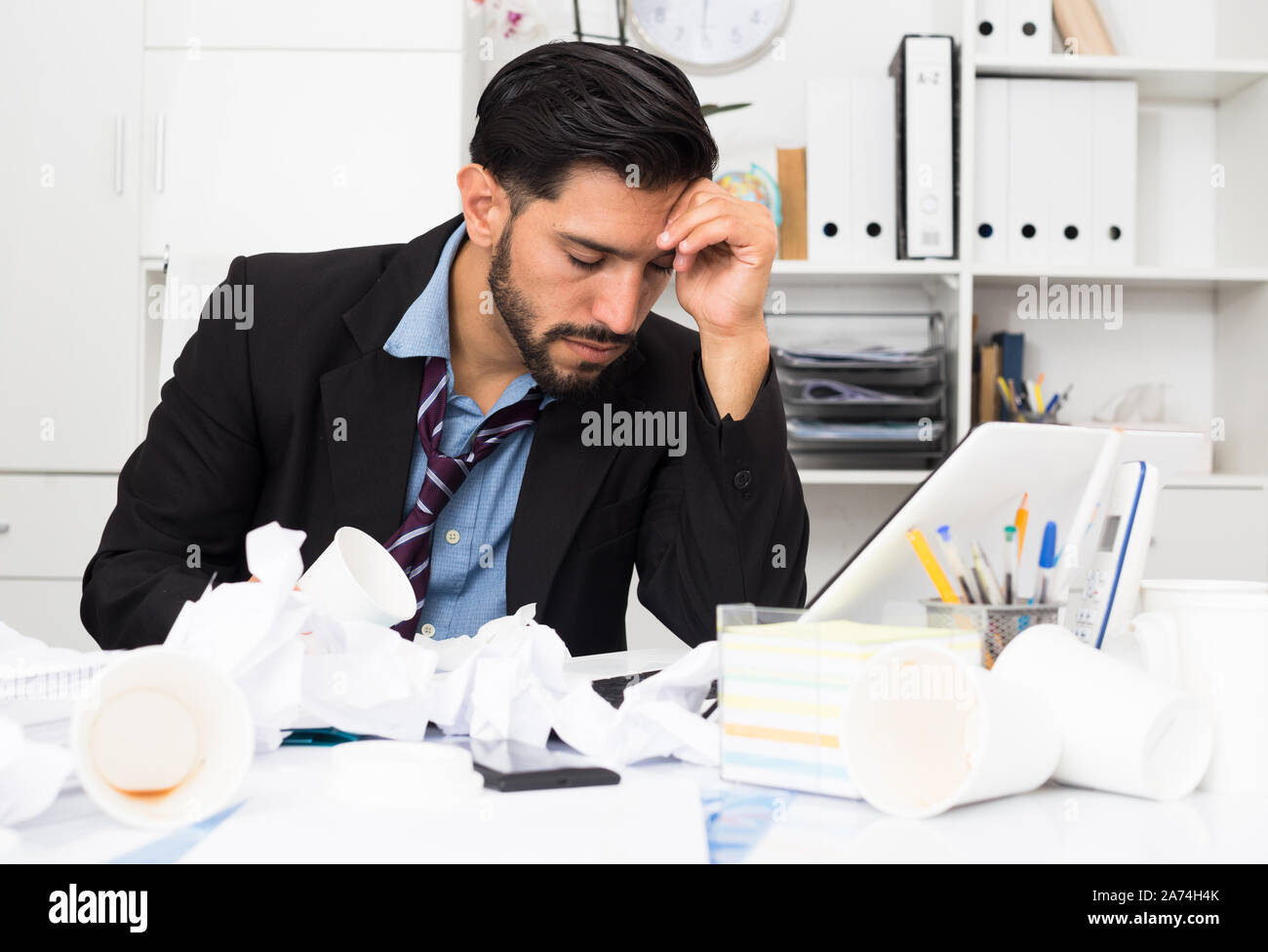 Spanish male worker is having complicated issue with project in office ...