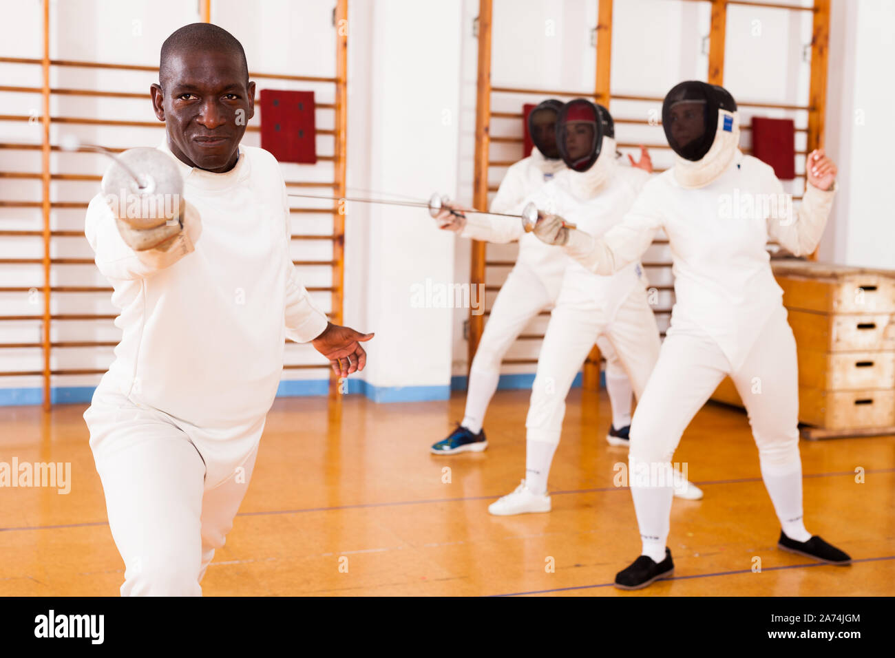 Sporty african american man fencer practicing effective fencing ...