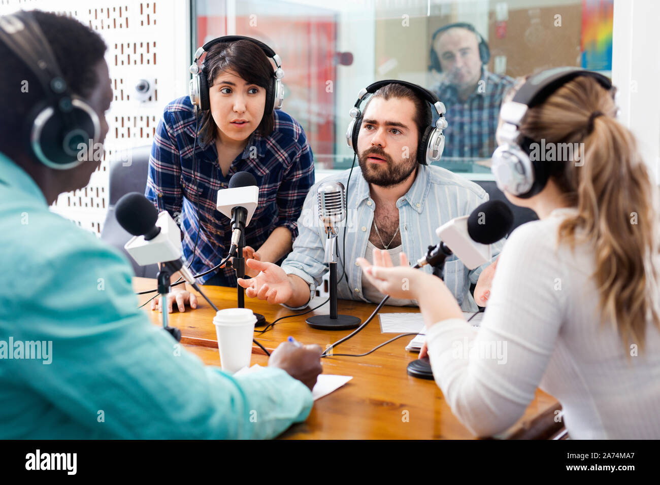 Scandal interview. Two young outraged guests answering provocative ...