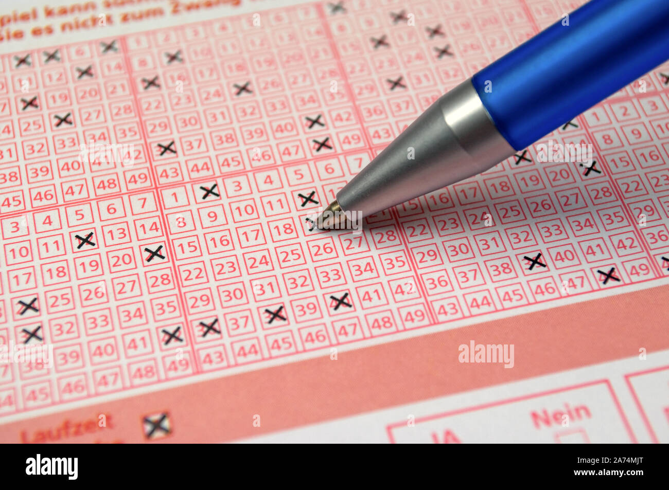 Lottery ticket and pen Stock Photo - Alamy
