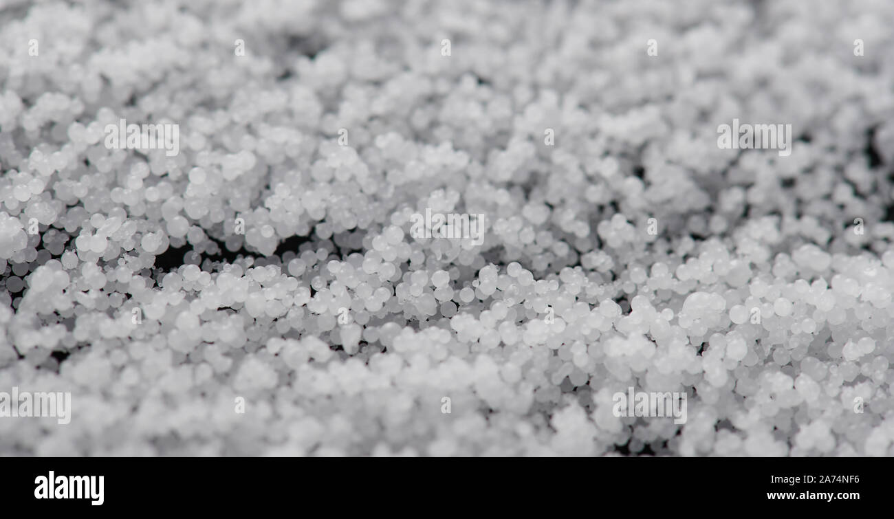 Small white wax balls background. Round granules Stock Photo - Alamy