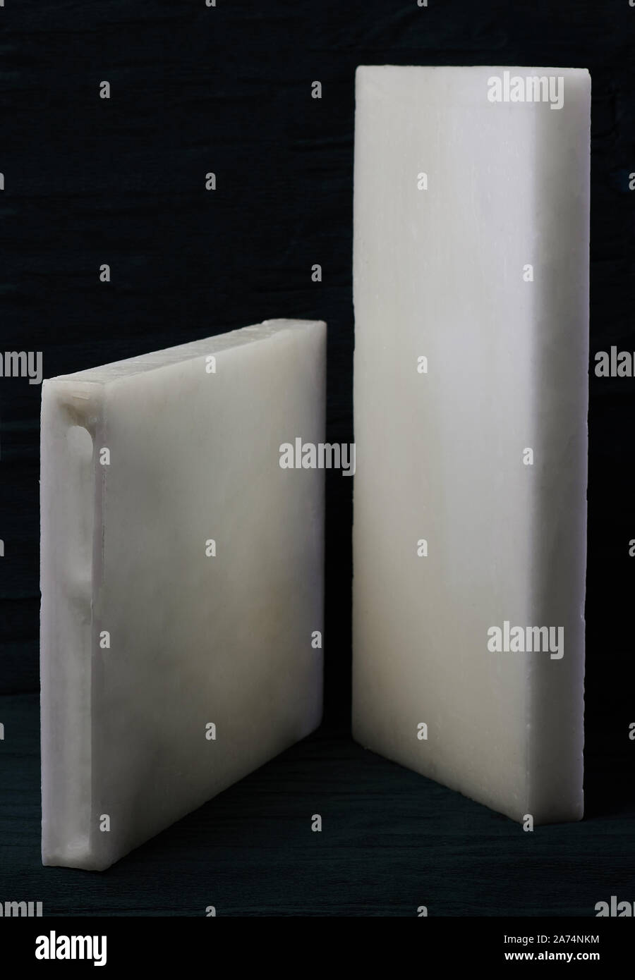 White slab of wax isolated on black background Stock Photo - Alamy