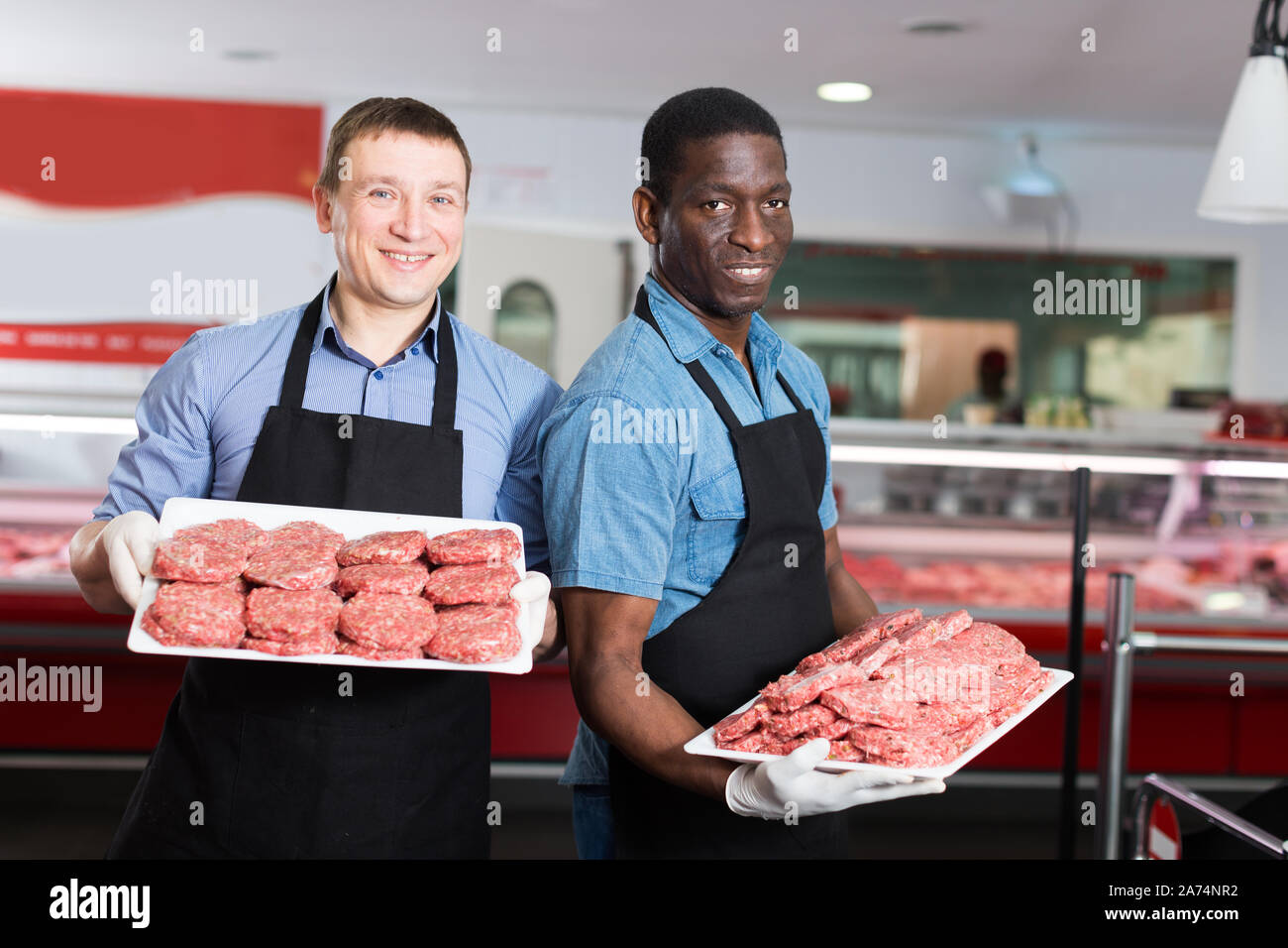 Successful sellers of butcher store offering fresh raw meat steak ...