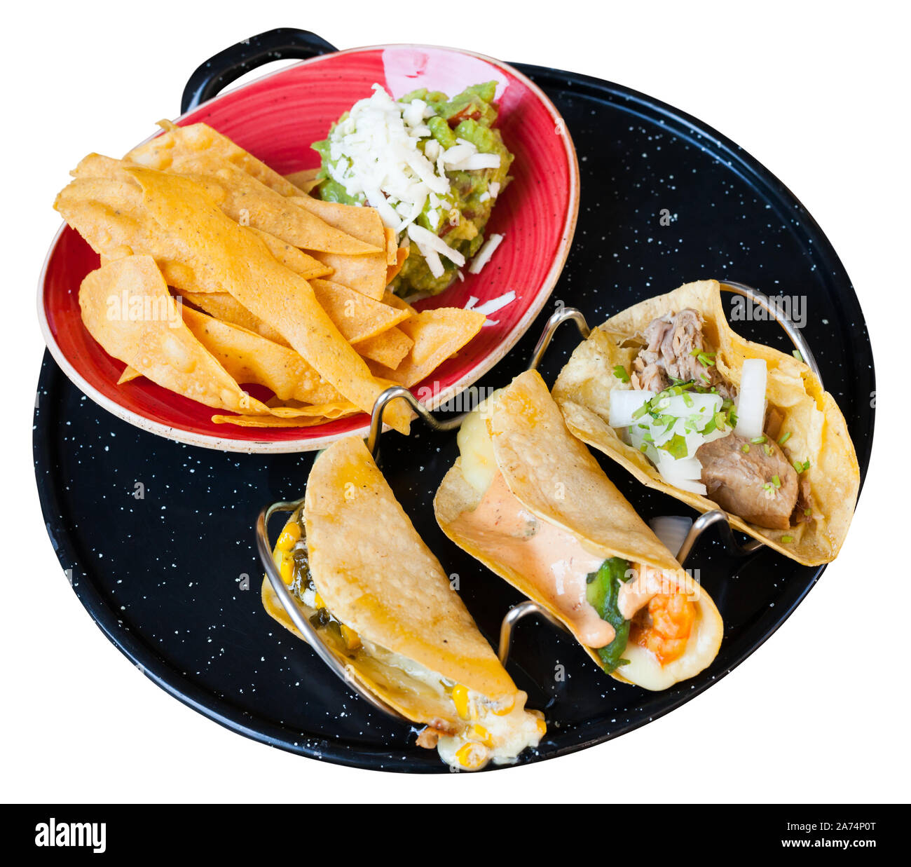 Traditional Mexican tacos with various fillings served with guacamole ...