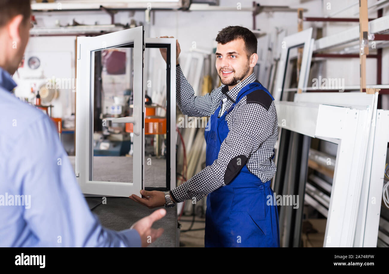Production happy english worker in coverall demonstrating different PVC ...