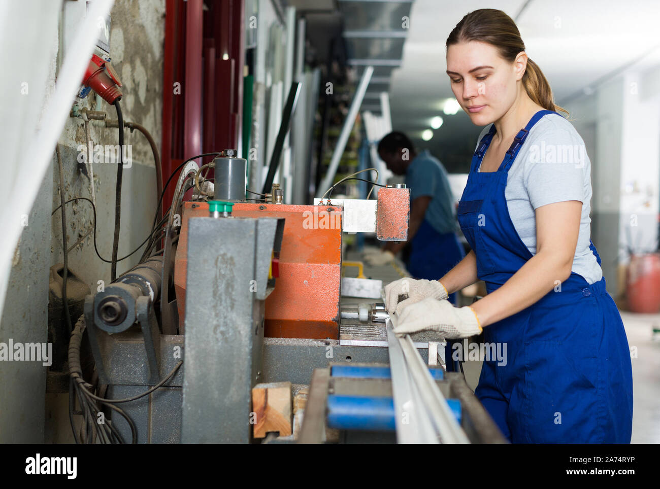 Female master working machine hi-res stock photography and images - Alamy