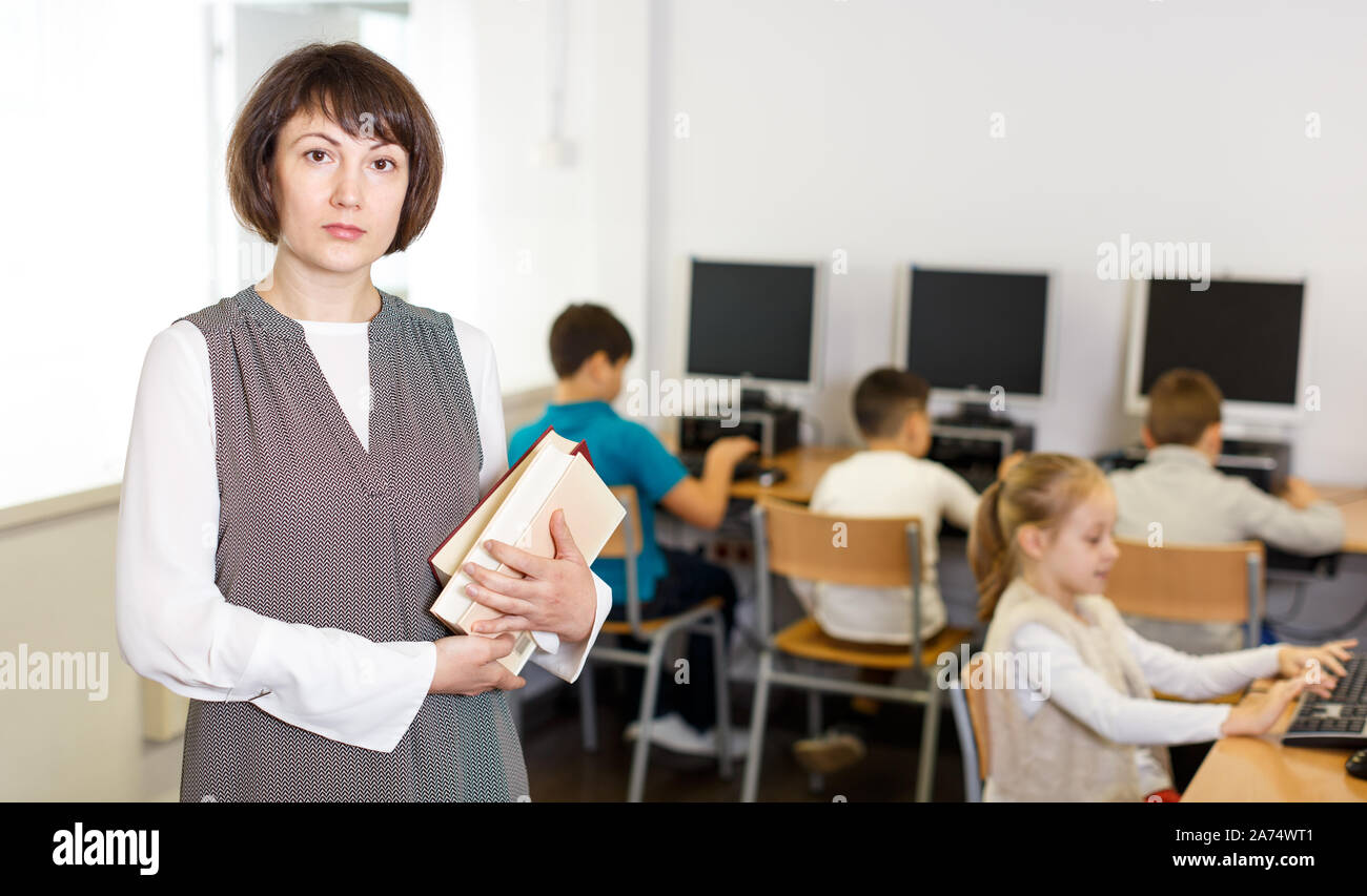 Children teacher teaching class serious hi-res stock photography and ...
