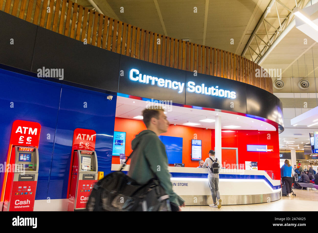 Liverpool, John Lennon Airport, UK. Passengers at Currency Solutions ...