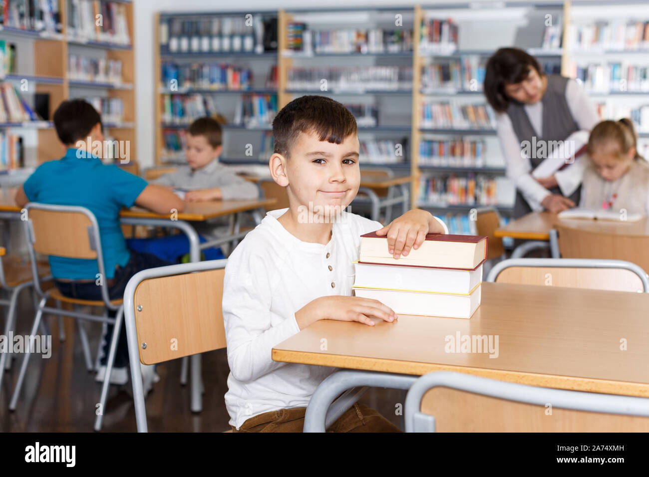 Librarian desk boy hi-res stock photography and images - Alamy