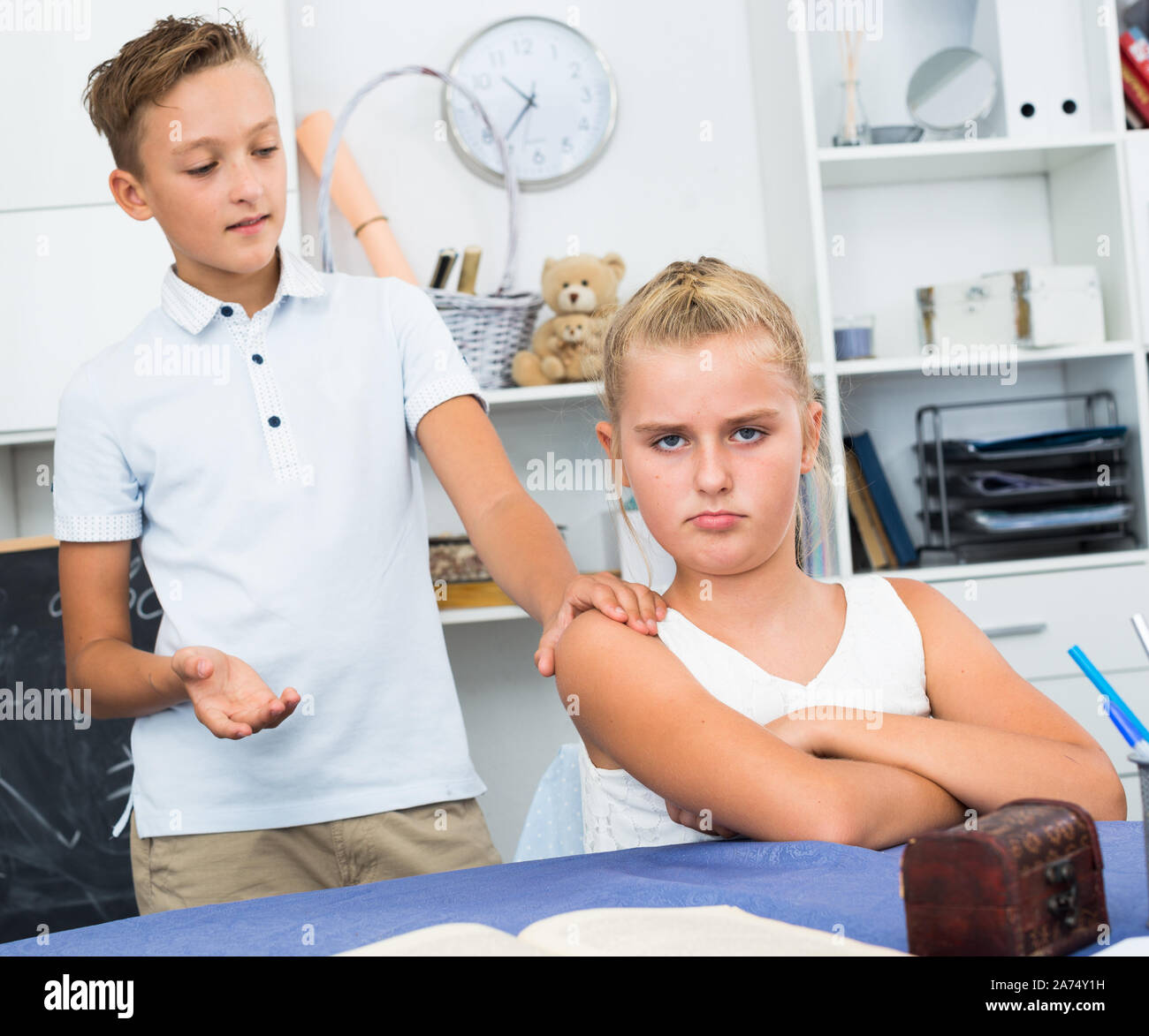 Boy is apologizing to a girlfriend for bad behavior at time play Stock ...