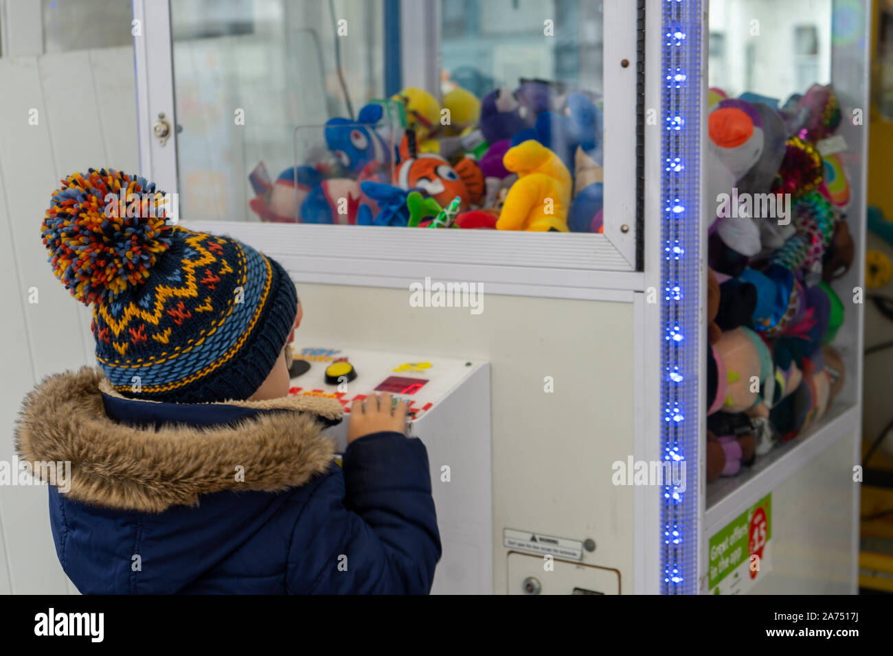 Claw game hi-res stock photography and images - Alamy