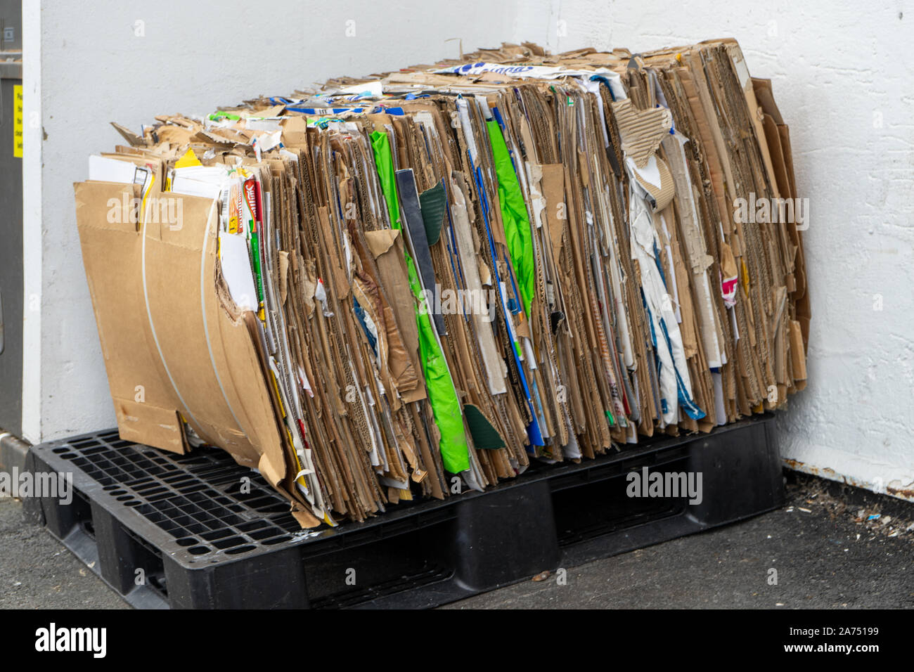 a stack of compacted cardboard ready to be recycled Stock Photo - Alamy